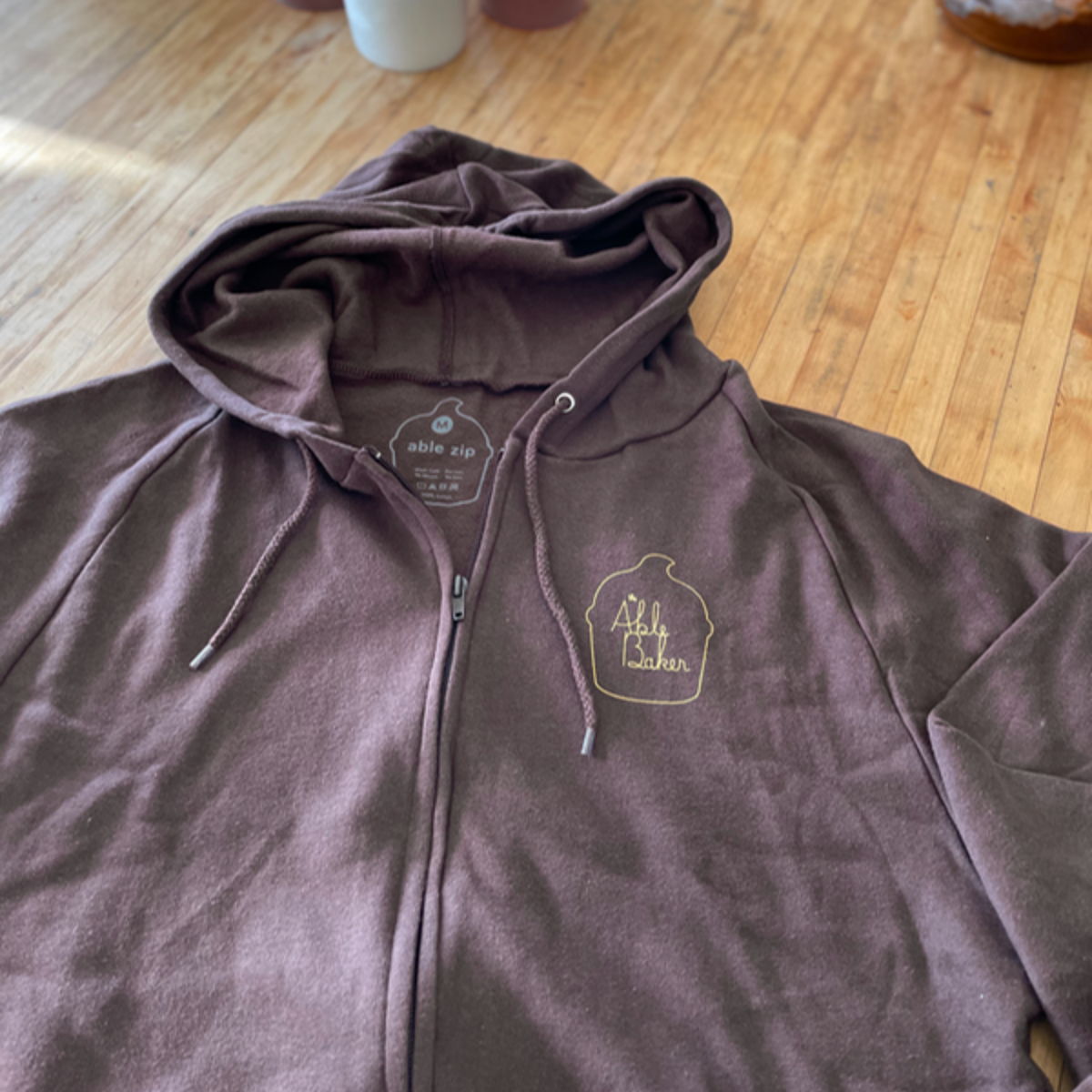 Bake happy.™ Hoodies | The Able Baker